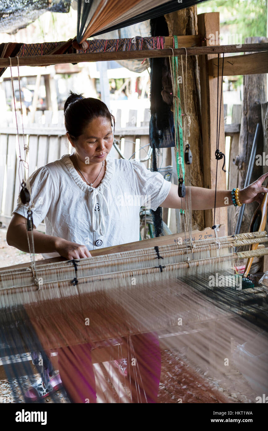 Tai Lue indigenous woman using a traditional loom, Northern Thailand ...