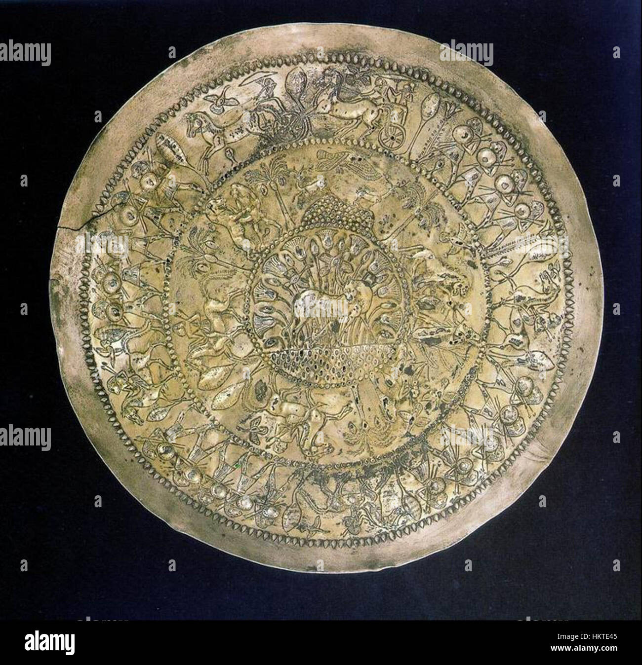 This piece is a silver Phoenician bowl, showcasing intricate design and ...