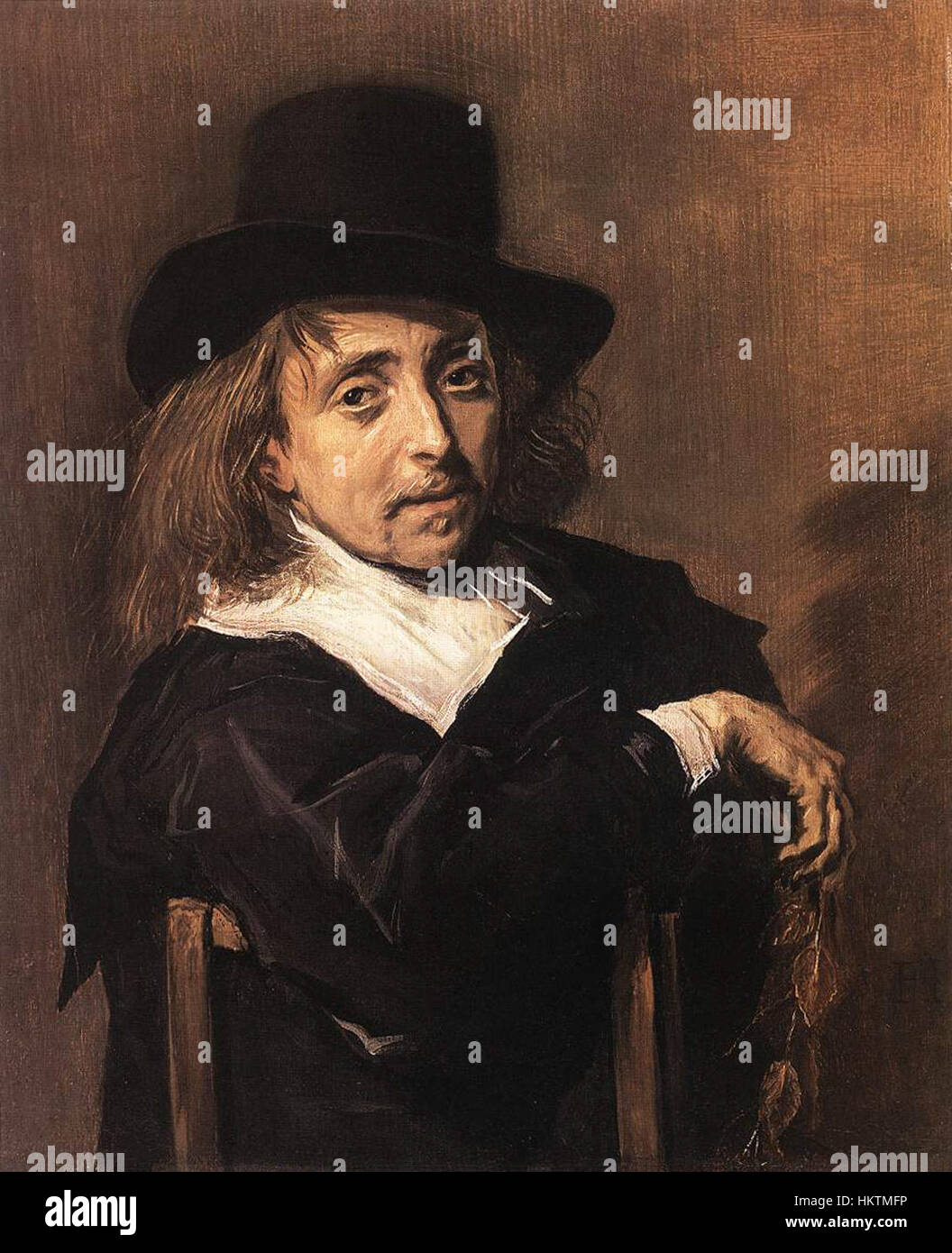 A portrait by Frans Hals of a seated man holding a branch, a fine ...