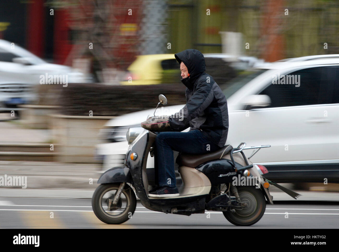 Nanchang, China's Jiangxi Province. 30th Jan, 2017. A man cycles ...