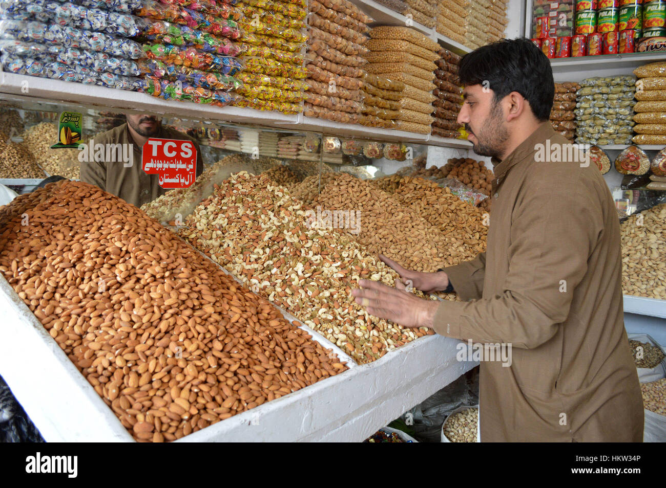 Quetta. 30th Jan, 2017. A shopkeeper arranges dry fruits at a shop in ...