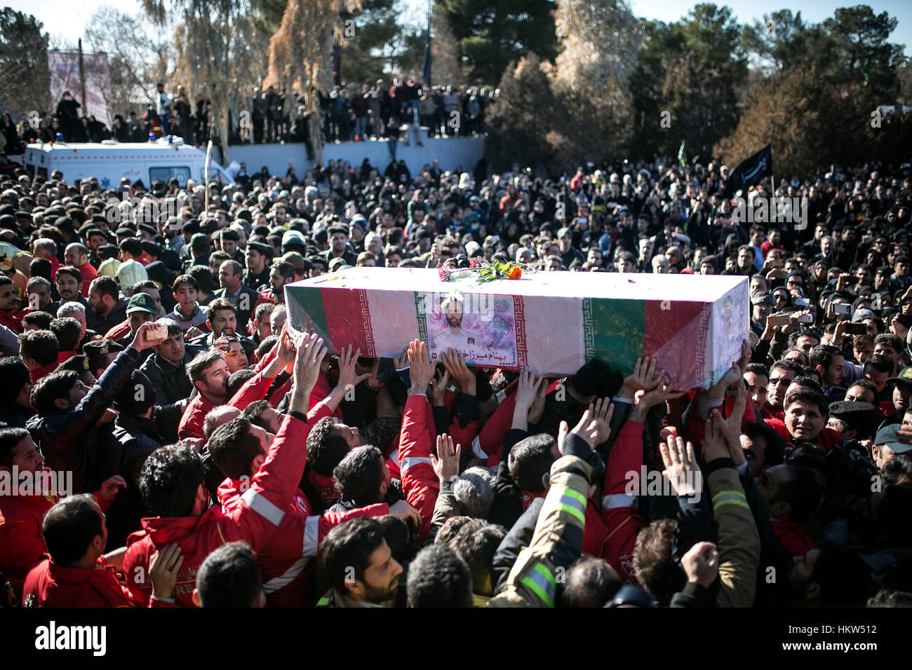 Tehran, Iran. 30th Jan, 2017. Iranian firefighters carry a coffin of ...