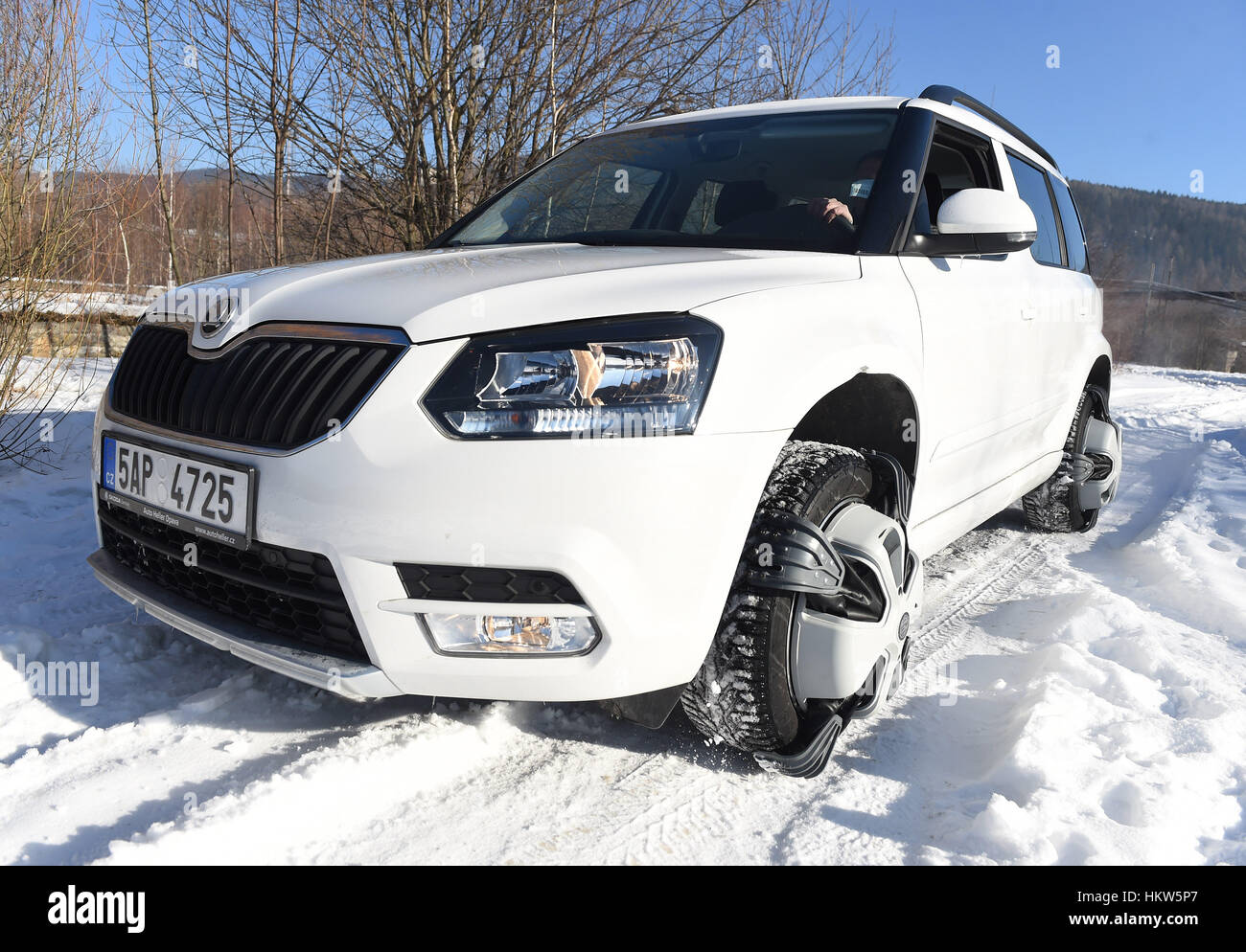 Automatic snow chains (system) from company IPG are mounted on the ...