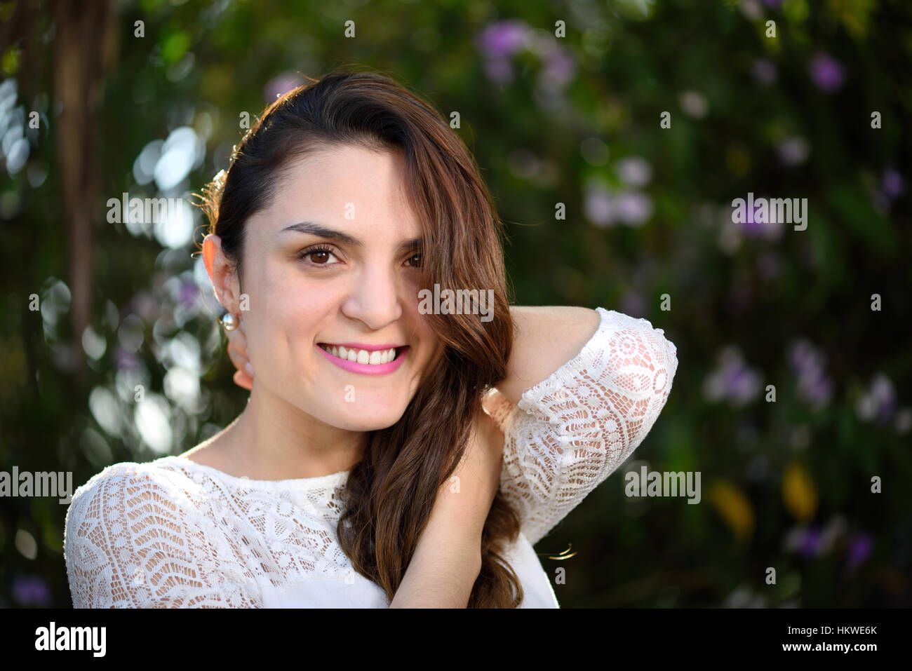 hispanic latino girl portrait on green sunny park Stock Photo - Alamy