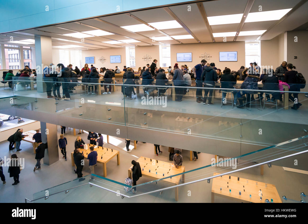 Customers shopping and browsing in the Soho Apple Store in New York ...