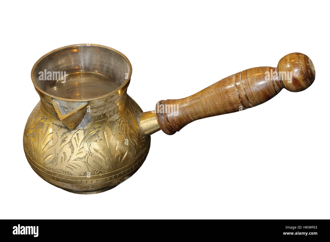 old traditional alloy kettle with wooden handle isolated over white ...