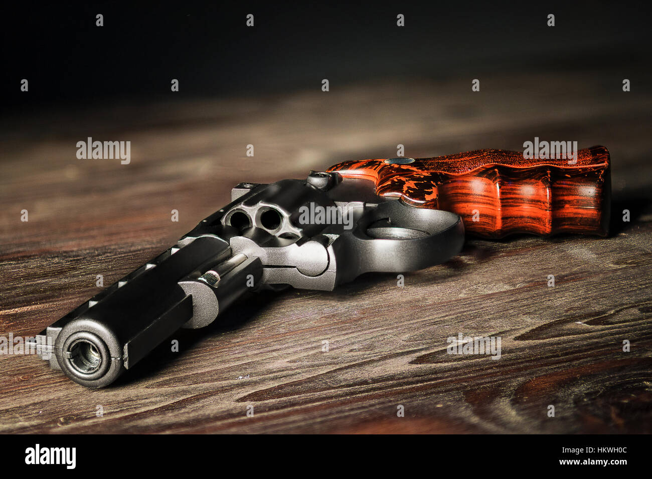 The gun on the table Stock Photo - Alamy