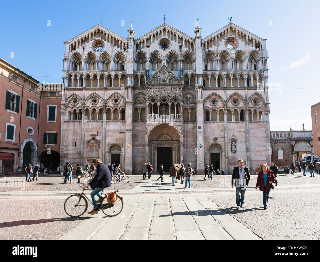 FERRARA, ITALY - NOVEMBER 6, 2012: Duomo Cathedral and people on piazza ...