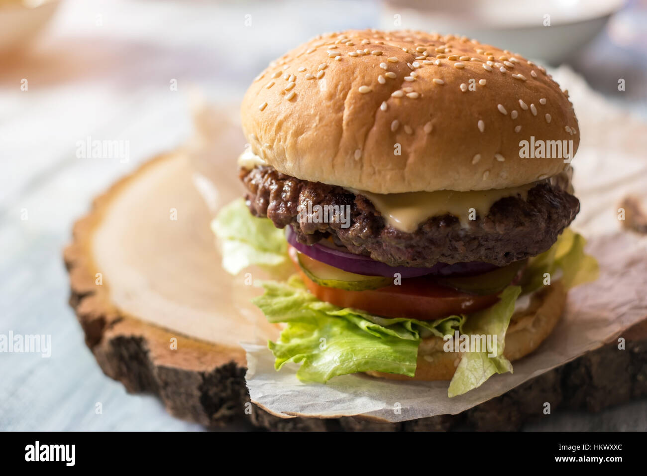Burger on piece of paper Stock Photo - Alamy