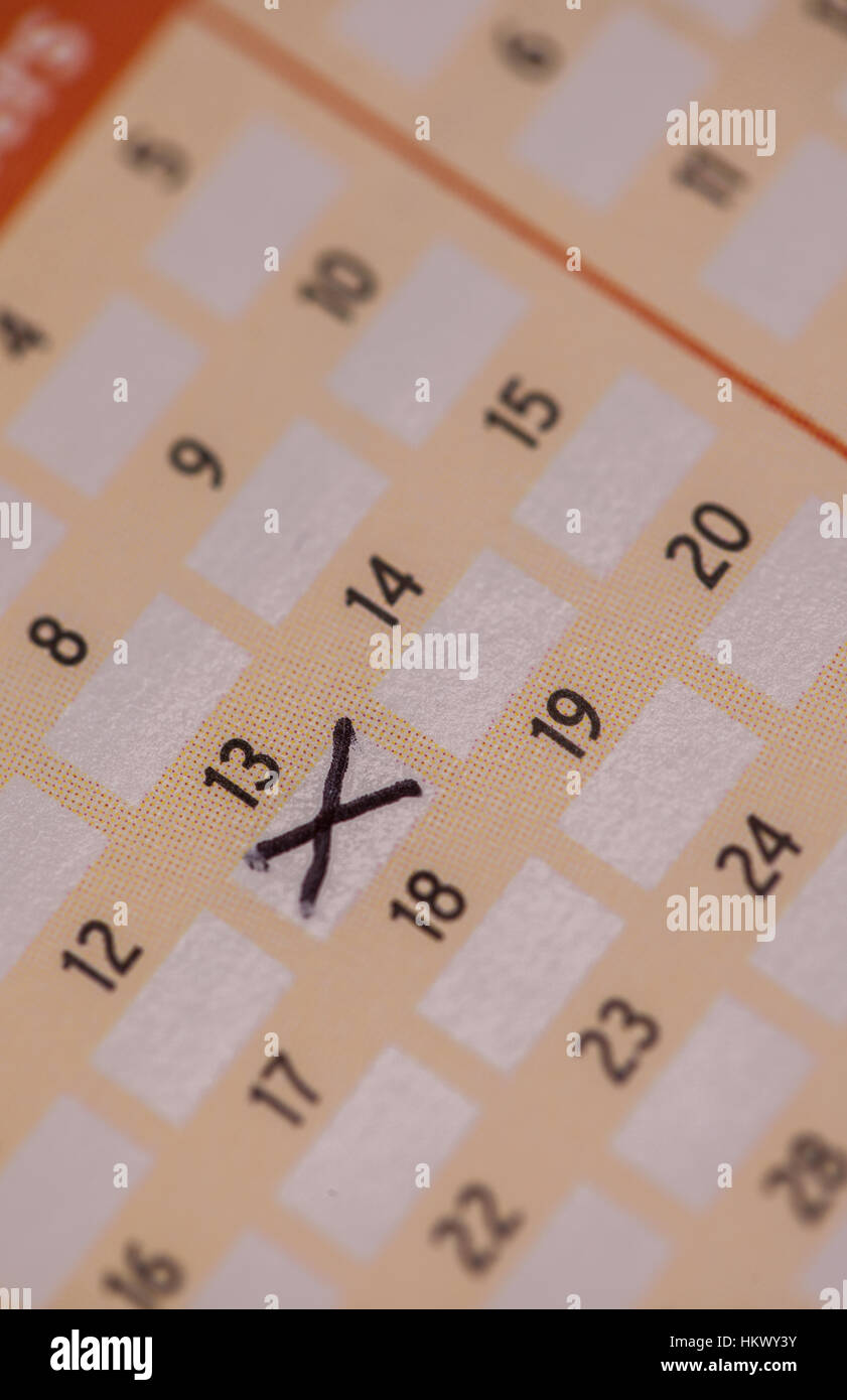Ticked lucky number 13 on the lottery slip Stock Photo - Alamy