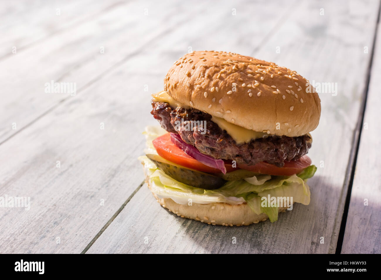 Burger on gray wooden background Stock Photo - Alamy
