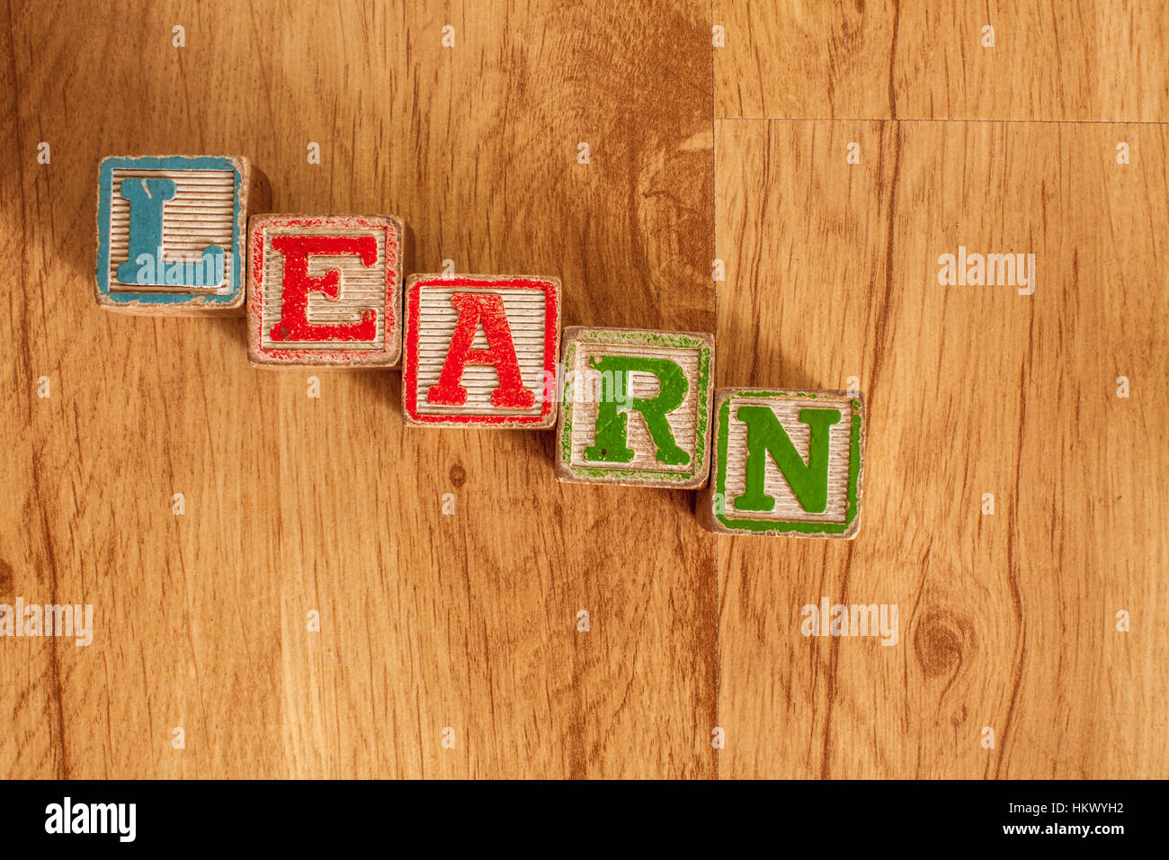 Vintage Wooden Childrens Blocks spell out the word Learn Stock Photo ...