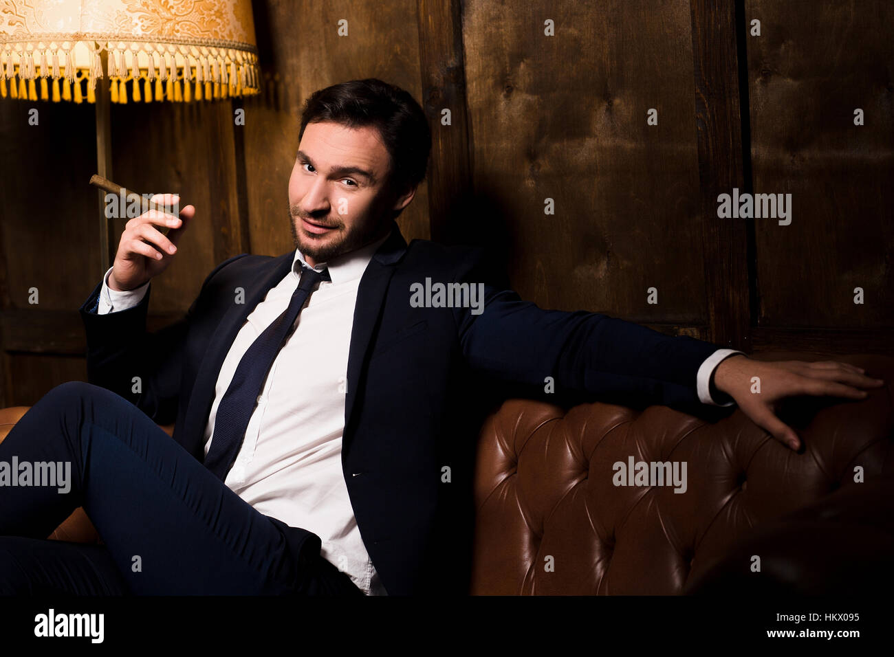 Rich businessman with cigar Stock Photo - Alamy