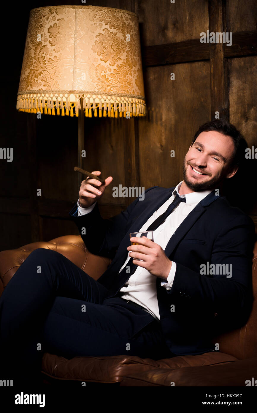 Rich businessman with cigar Stock Photo - Alamy