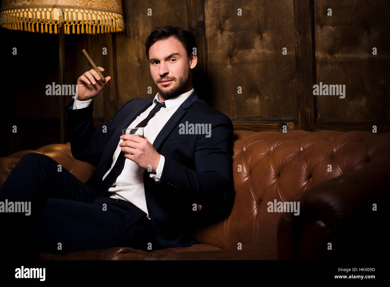 Rich businessman with cigar Stock Photo - Alamy