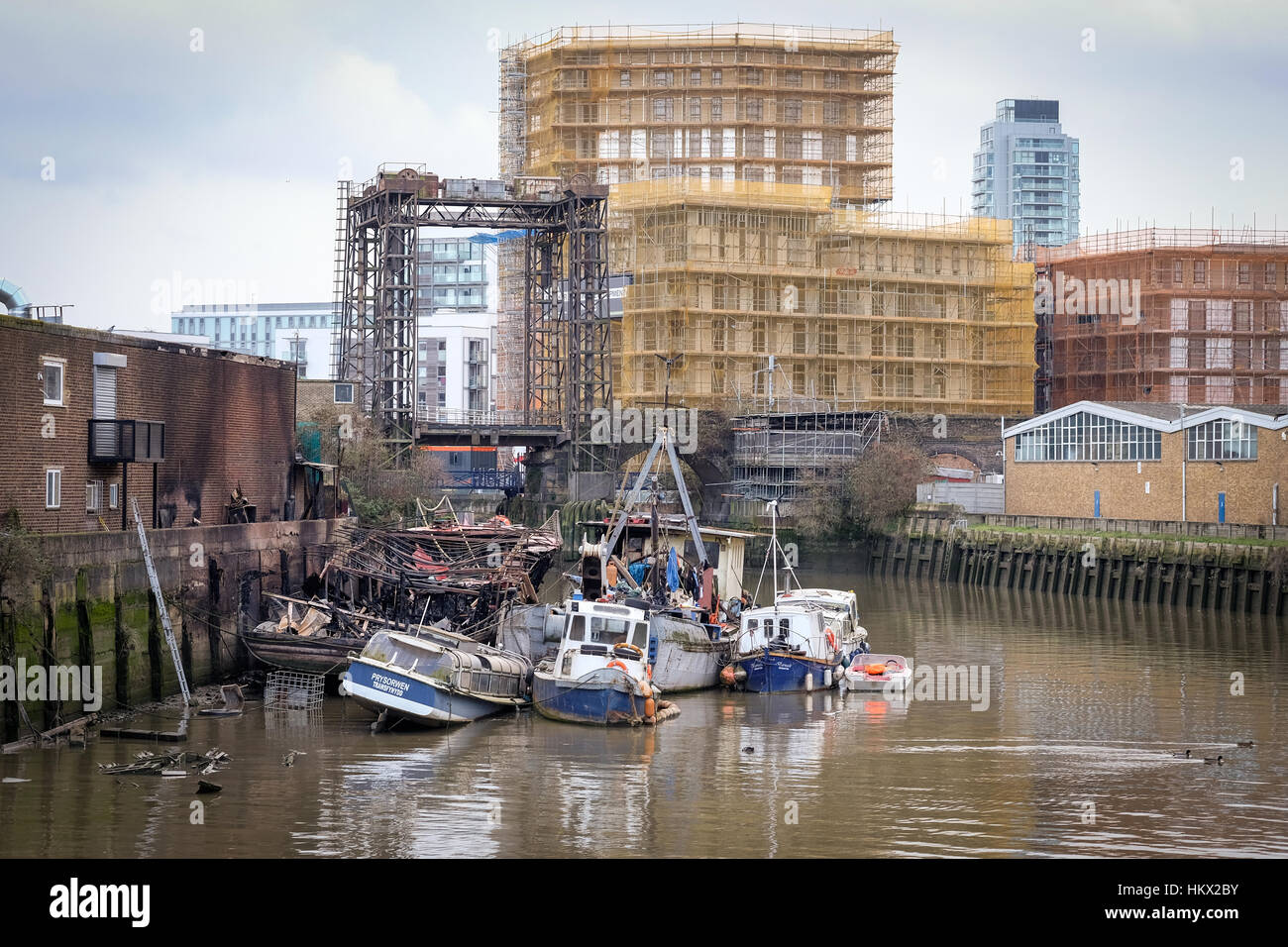 Boats on Deptford Creek showing burnt out Ham class minesweeper and new ...
