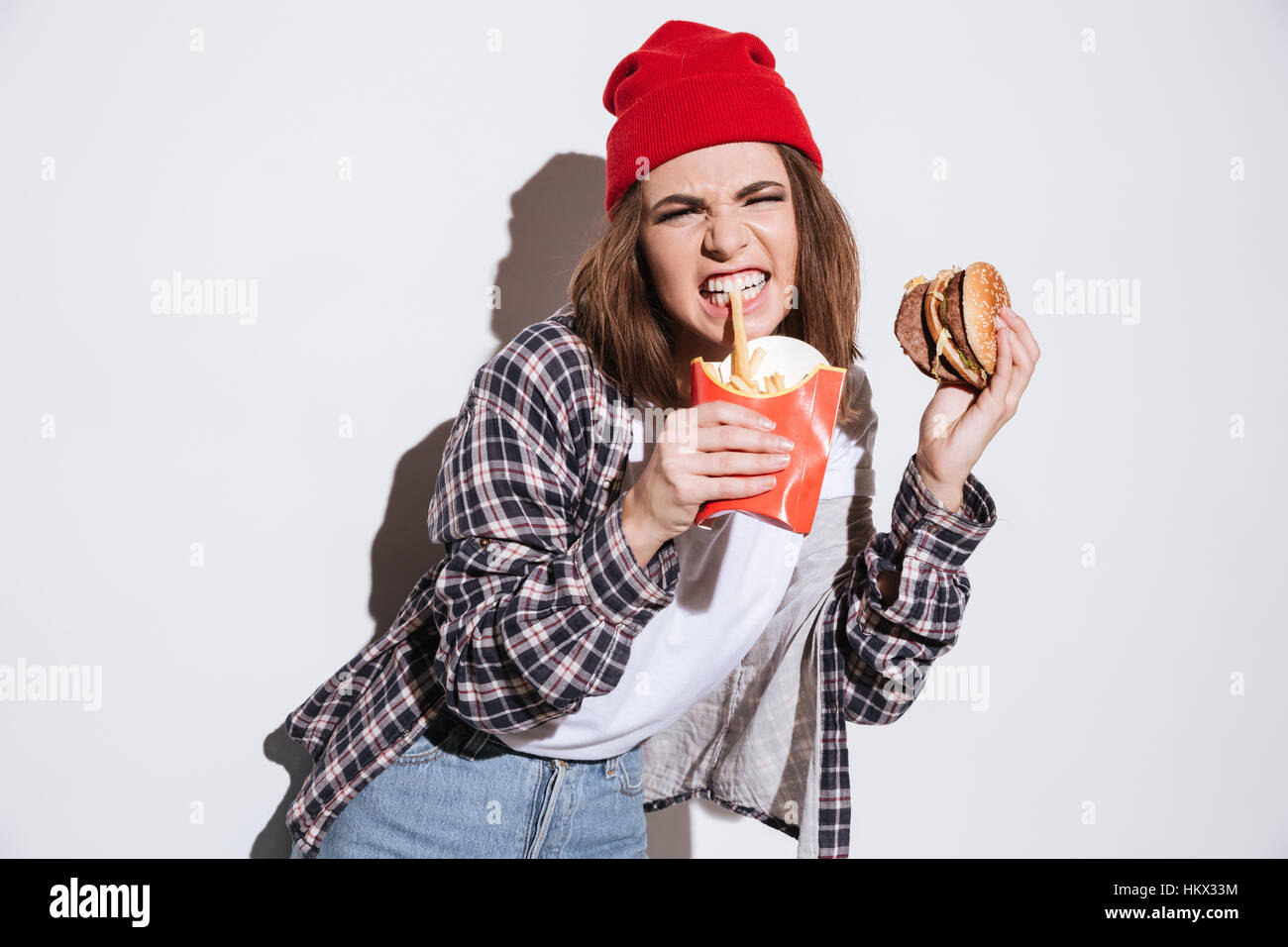 Picture of hungry angry woman dressed in shirt in a cage print wearing ...