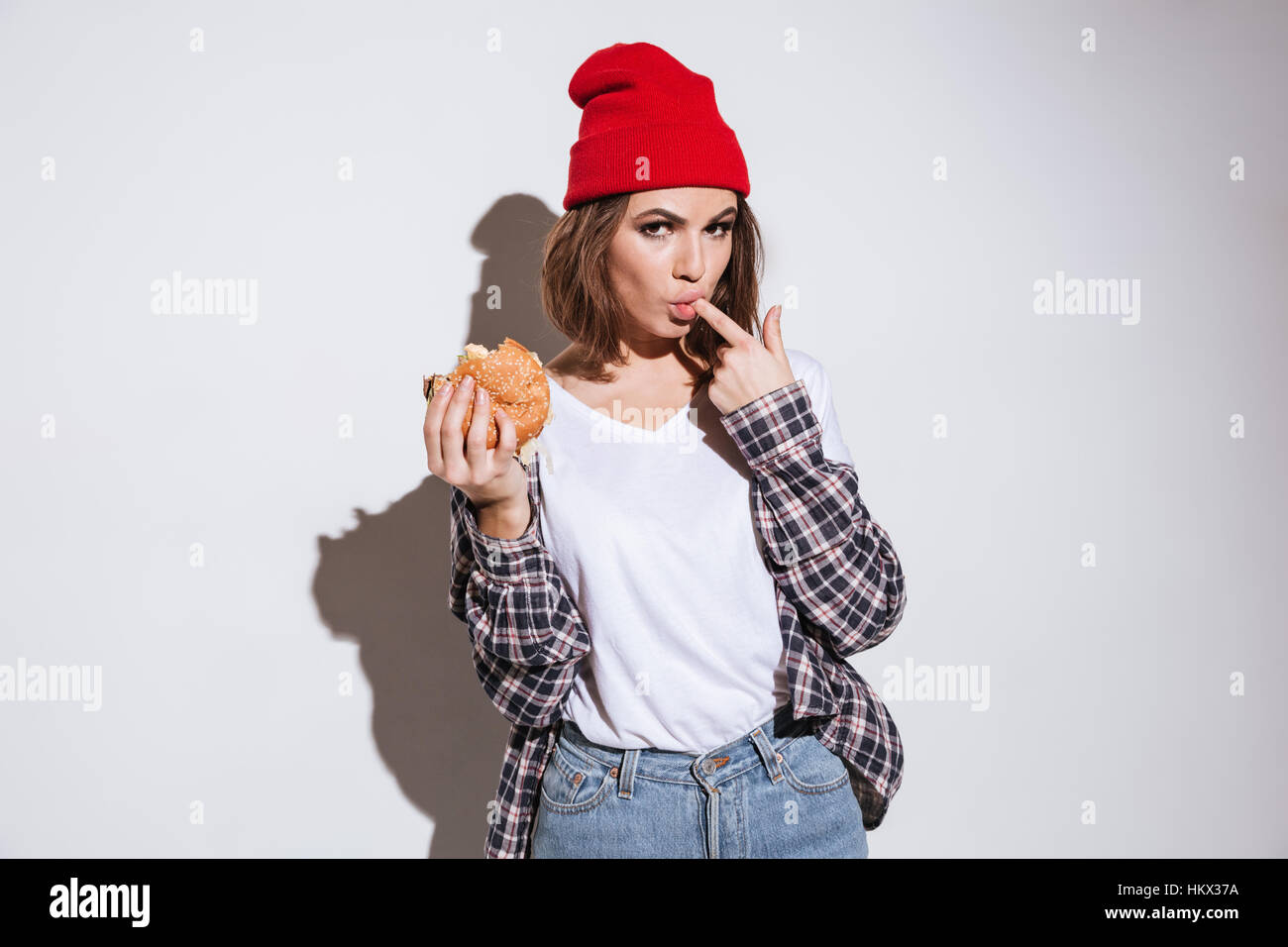 Picture of young hungry lady dressed in shirt in a cage print wearing ...
