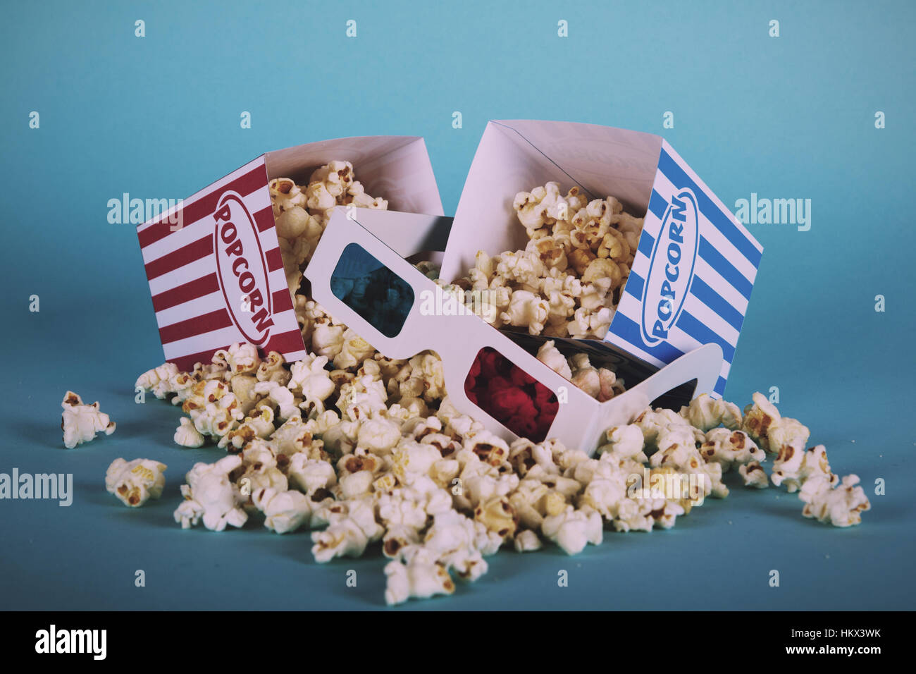 Bucket of popcorn against a blue background Vintage Retro Filter Stock ...