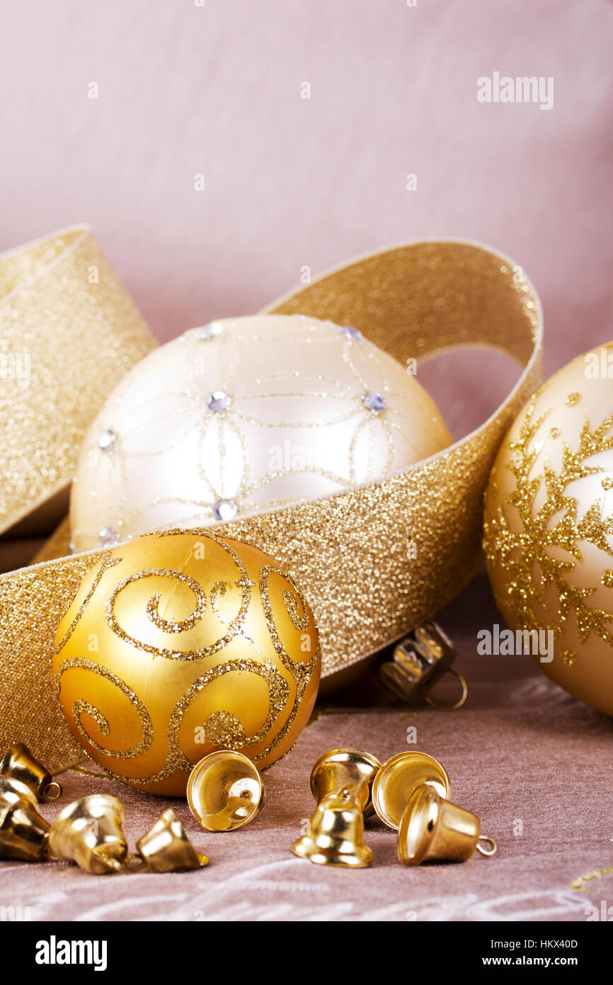 Festive gold Christmas decorations on a fabric background Stock Photo ...