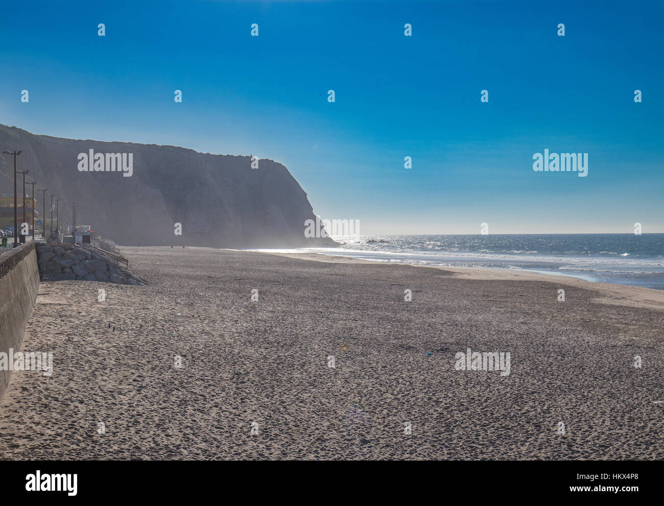 Cape hidden by a thin layer of fog during a rather sunny morning in the ...