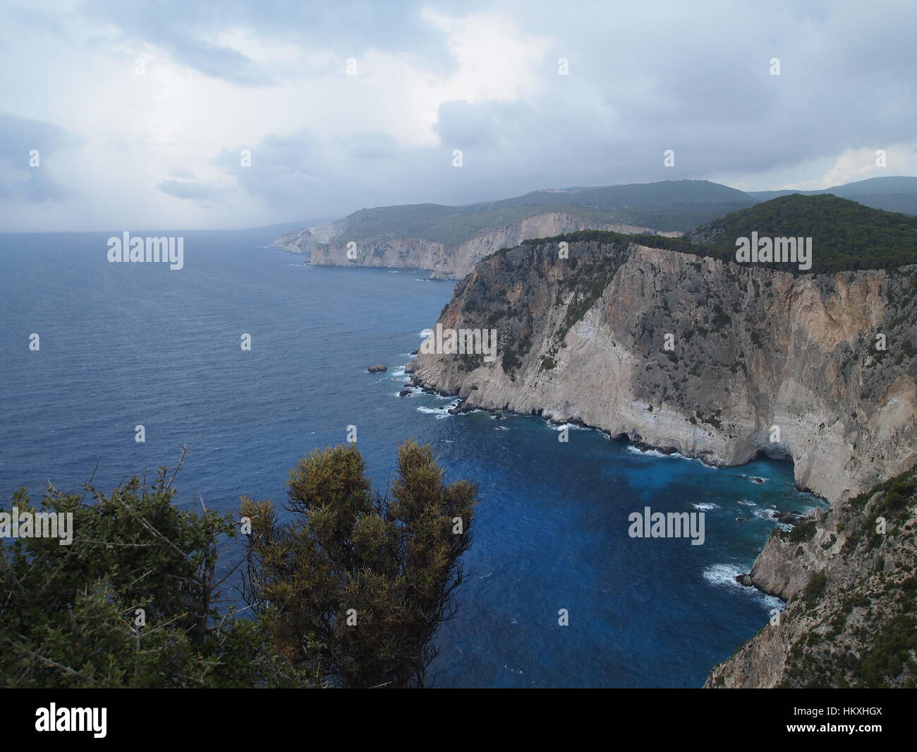 Very steep cliffs at Zakynthos island in Greece in cloudy summer day ...
