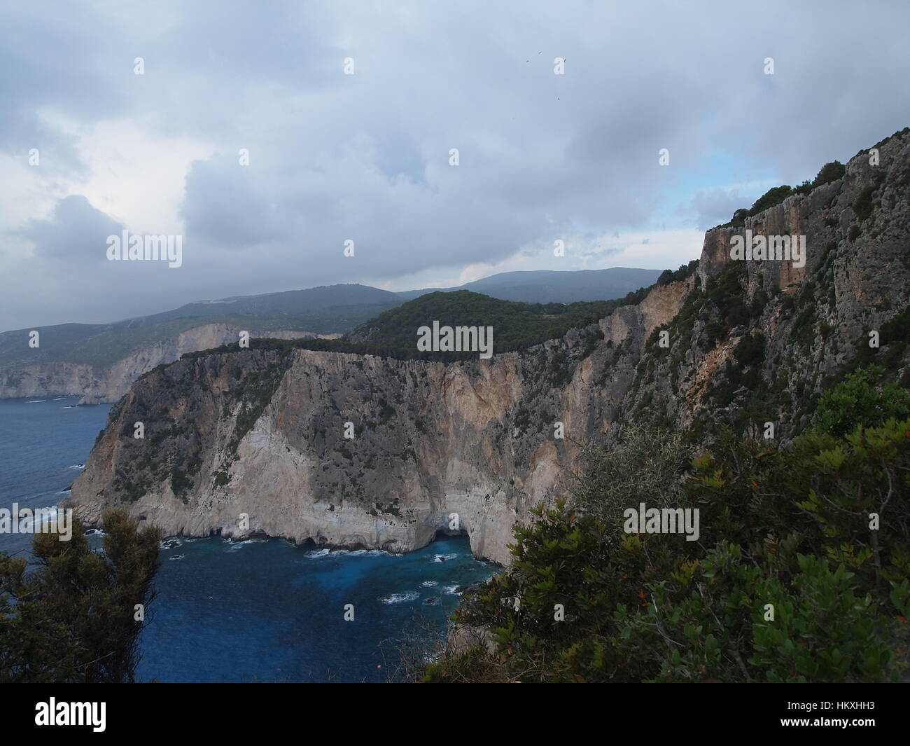 Very steep cliffs at Zakynthos island in Greece in cloudy summer day ...