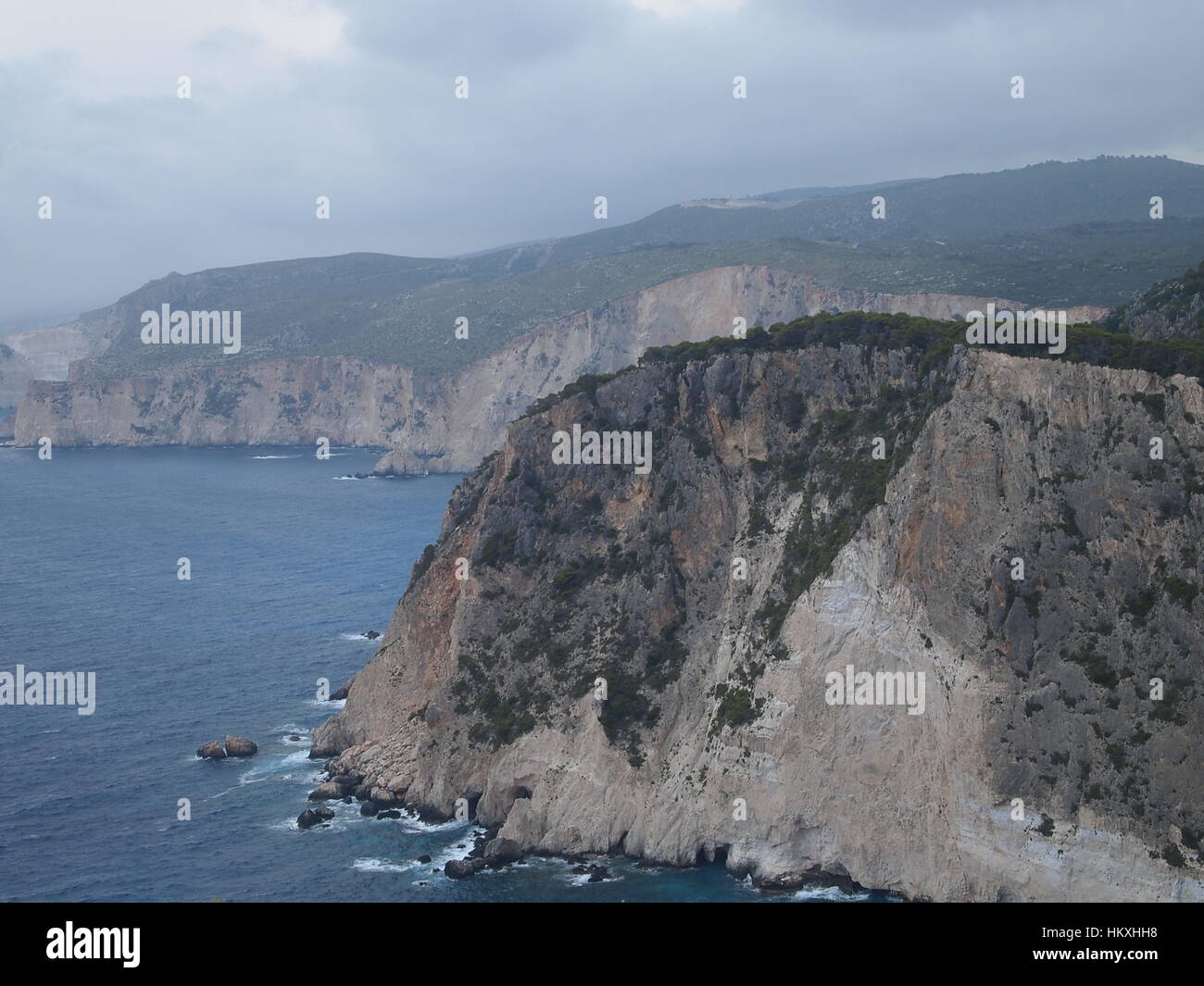 Very steep cliffs at Zakynthos island in Greece in cloudy summer day ...