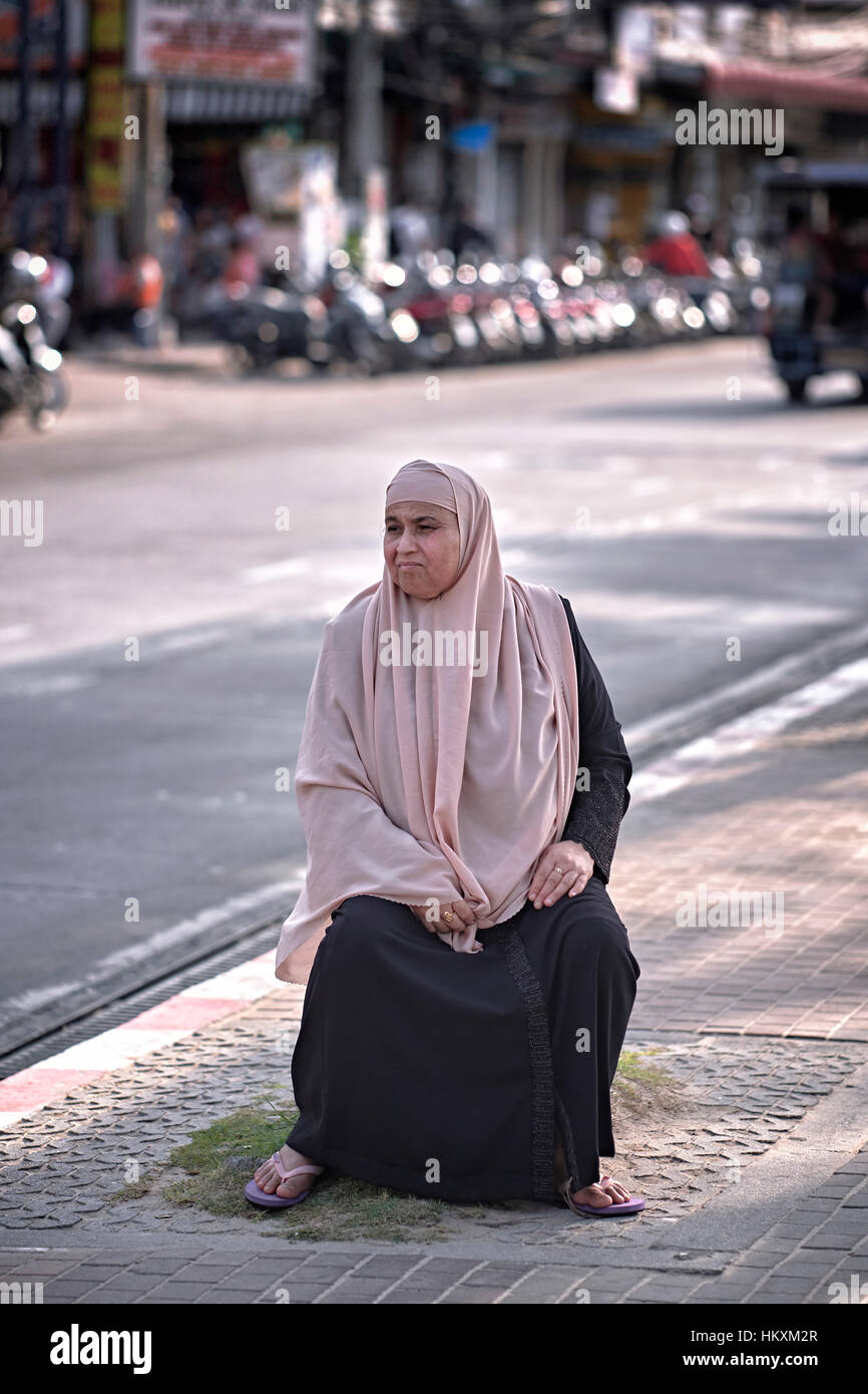 Muslim Arab woman wearing traditional Khimar head covering Stock Photo ...
