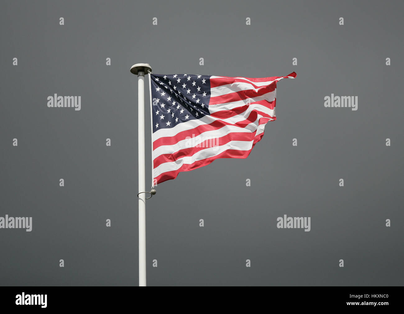 The american flag, the Star Spangled Banner in front of a dark sky ...
