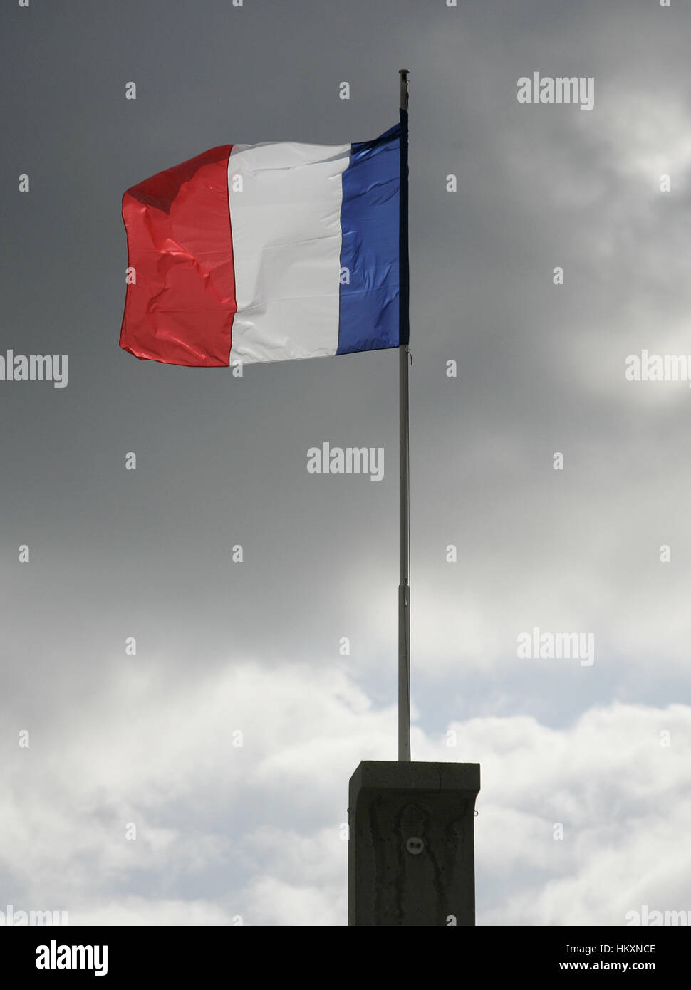 French flag in front of a dark sky Stock Photo - Alamy