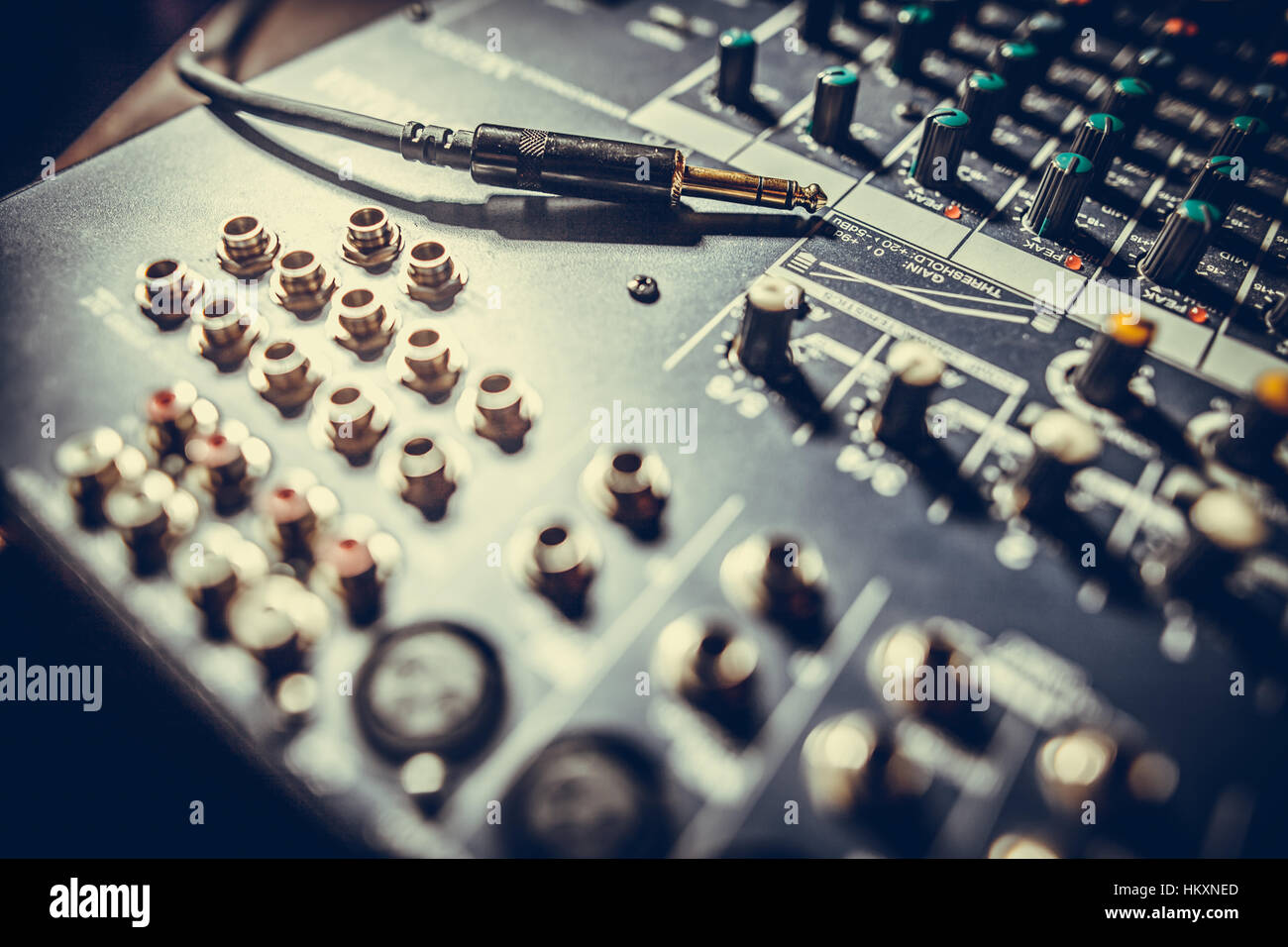 Close up shot of a mixer desk with many buttons and cables Stock Photo ...