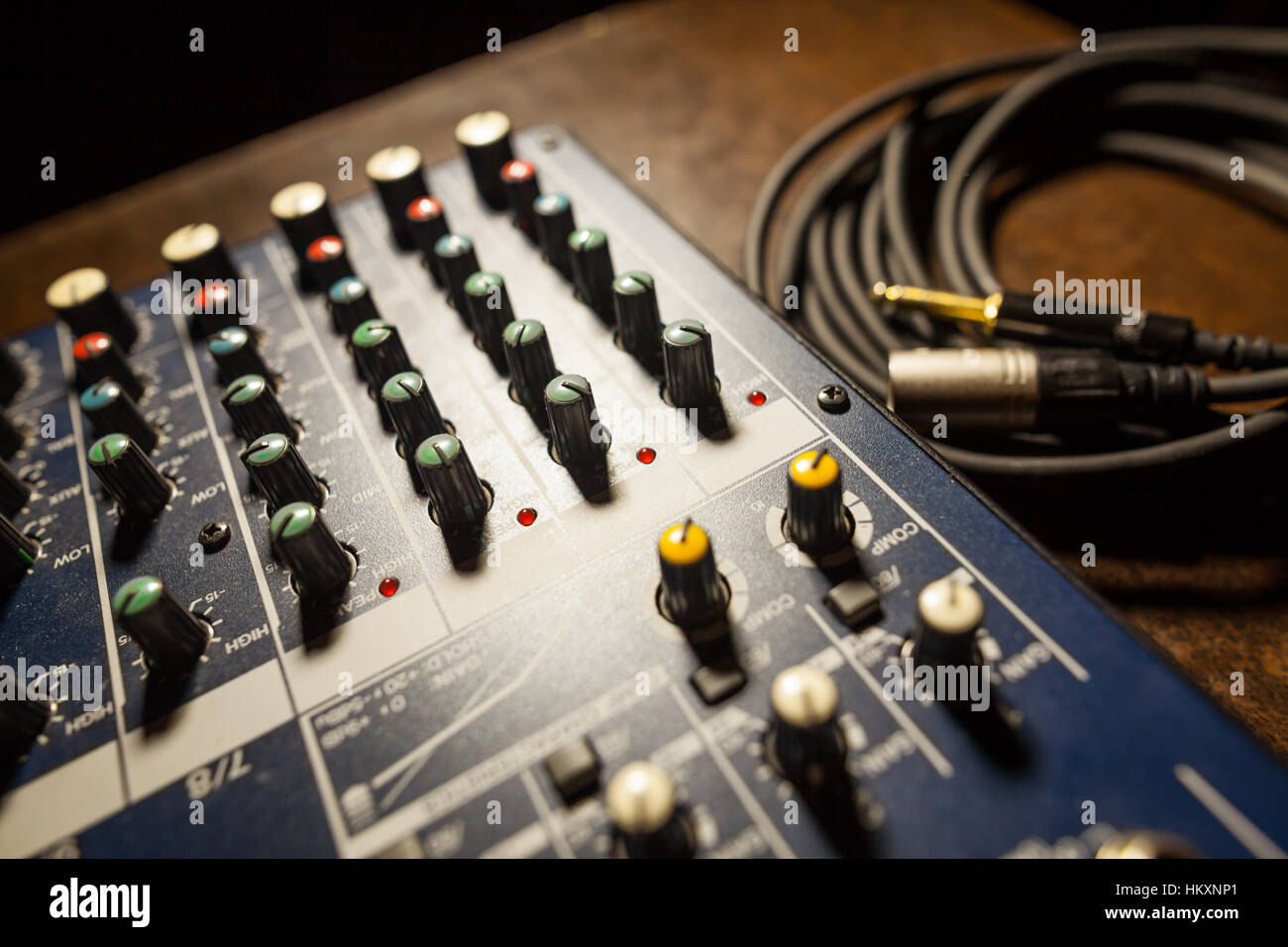 Close up shot of a mixer desk with many buttons and cables Stock Photo ...