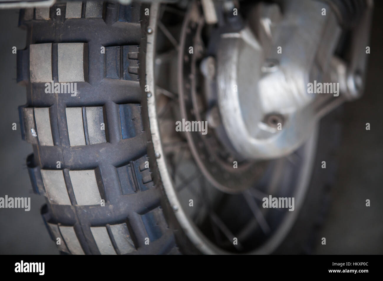 Close up shot of a motorcycle rear wheel, with knobby tire Stock Photo ...