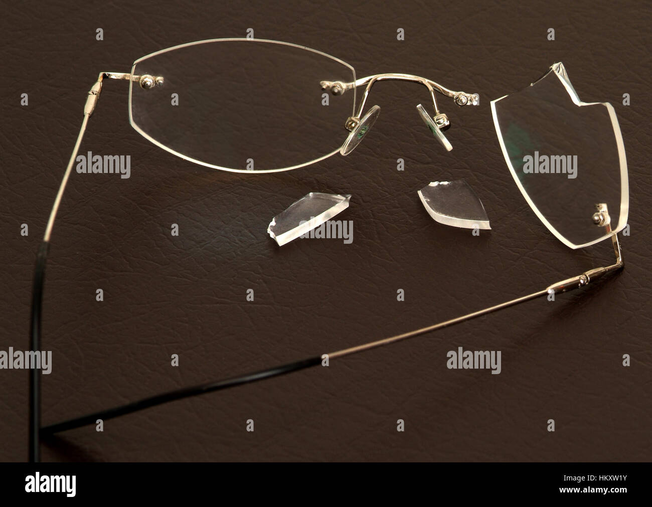 Broken eyeglasses, breakage of glass Stock Photo - Alamy
