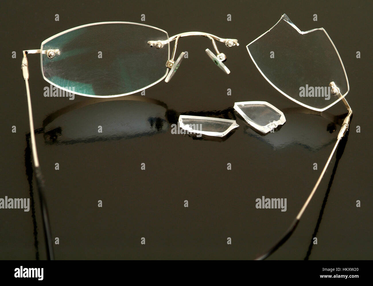 Broken eyeglasses, breakage of glass Stock Photo - Alamy