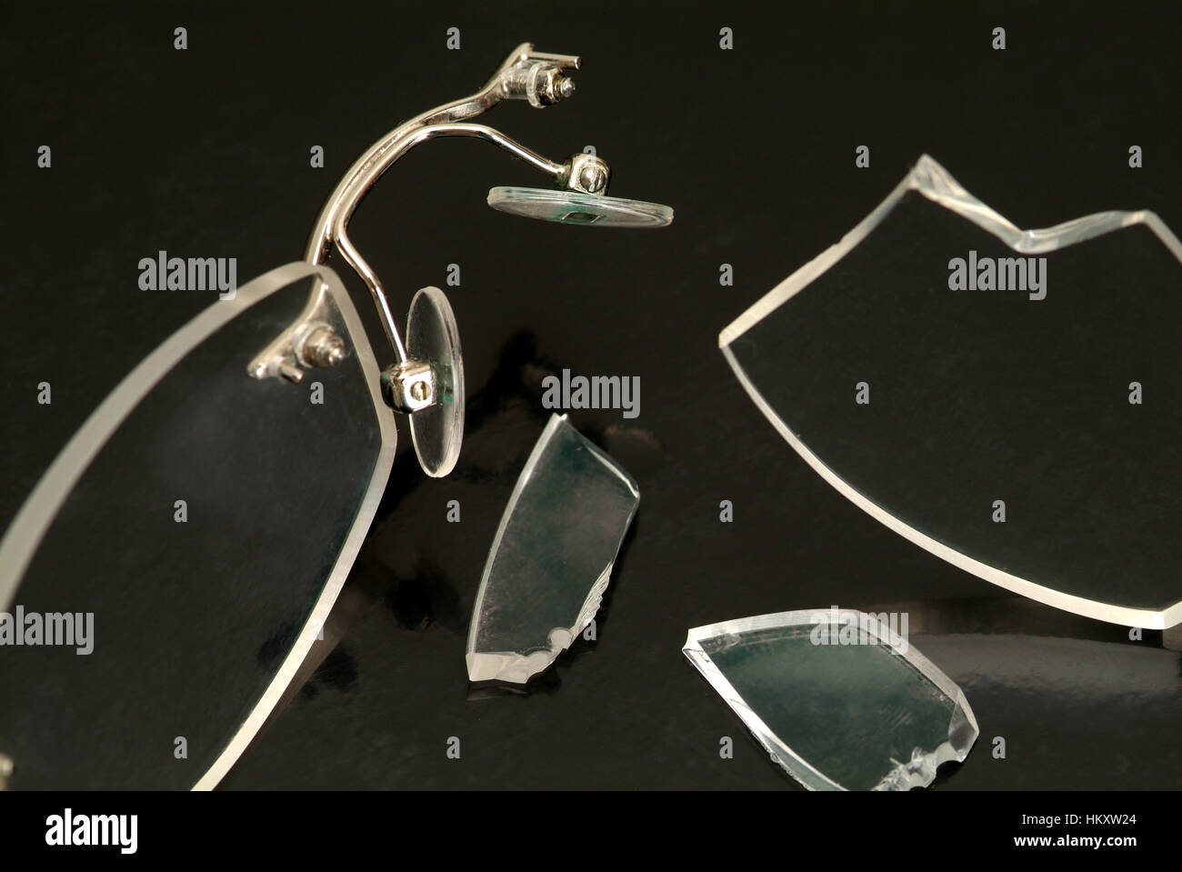 Broken eyeglasses, breakage of glass Stock Photo - Alamy