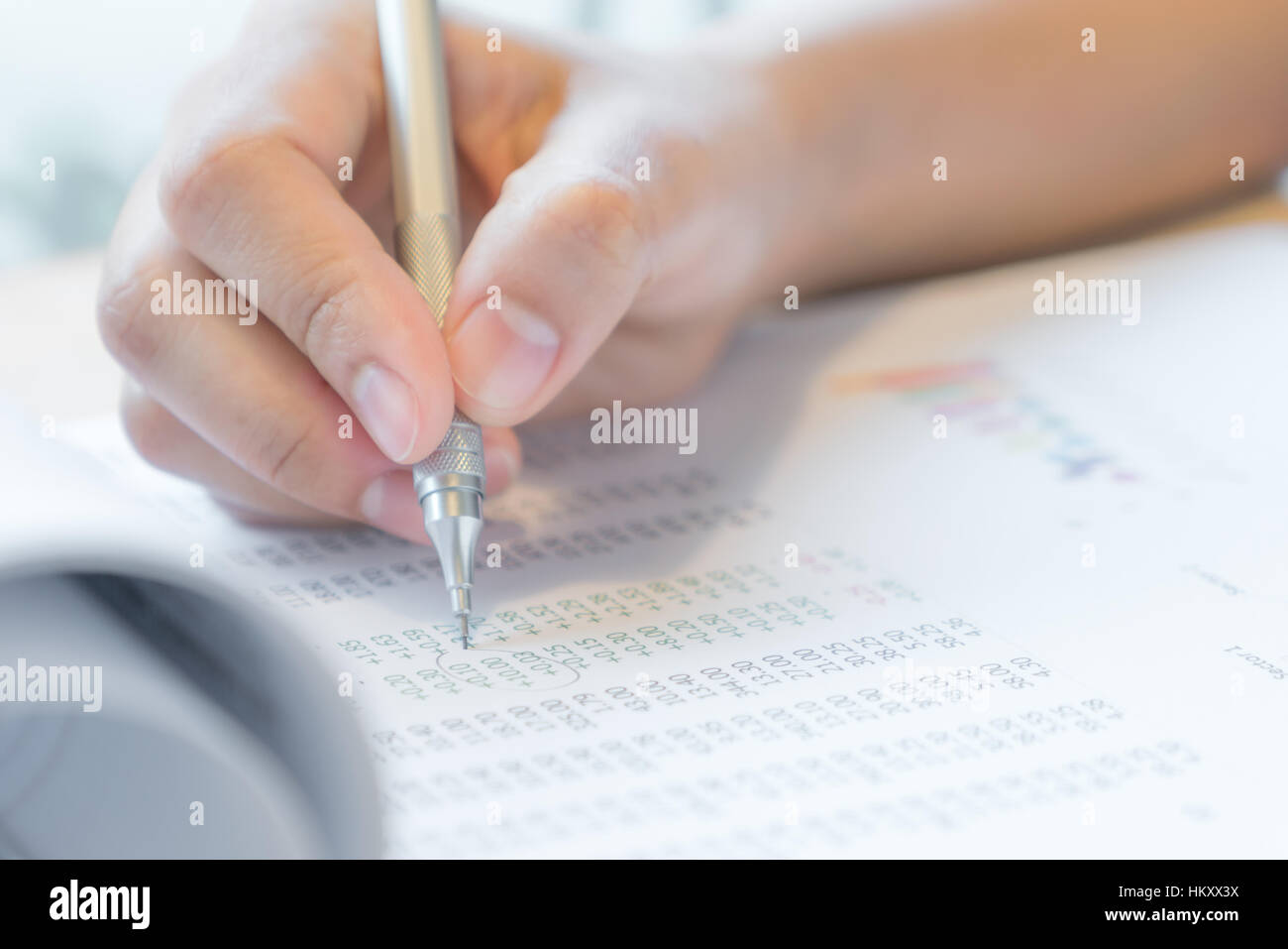 Hand write on Various financial charts on the table Stock Photo - Alamy