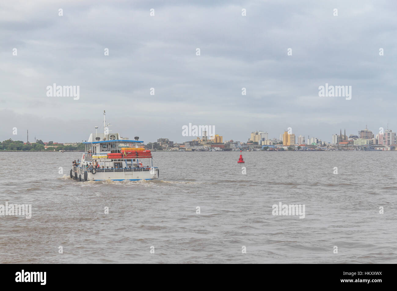 Ferry boat to Rio Grande old port, downtown buildings in background ...