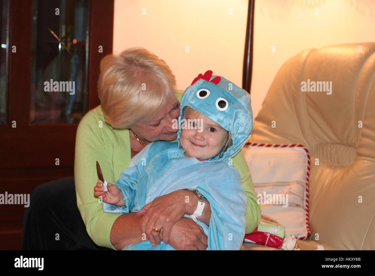 Little girl dressed Iggle Piggle wearing a hooded blue velvet onesie ...