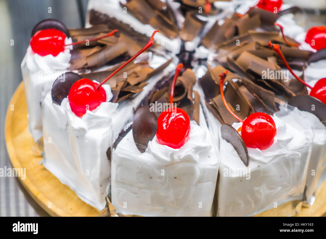 Chocolate cake with red cherries Stock Photo - Alamy