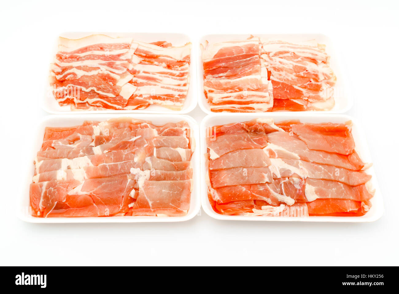 Slide of raw pork on white background Stock Photo - Alamy