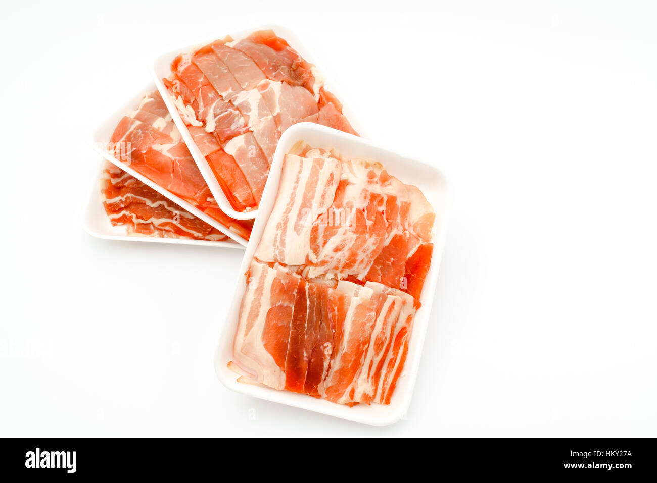 Slide of raw pork on white background Stock Photo - Alamy
