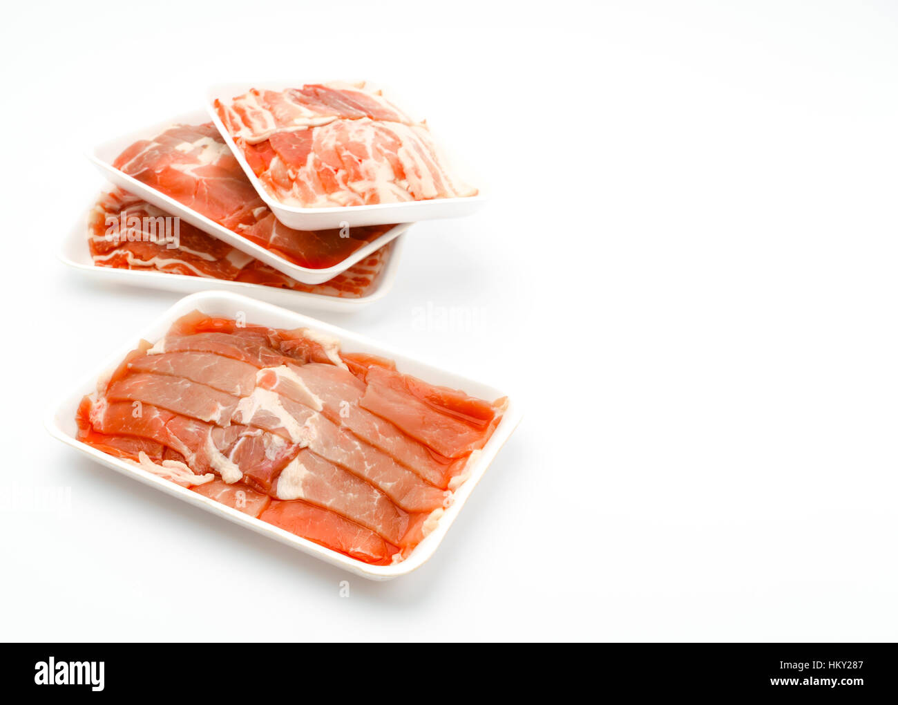 Slide of raw pork on white background Stock Photo - Alamy