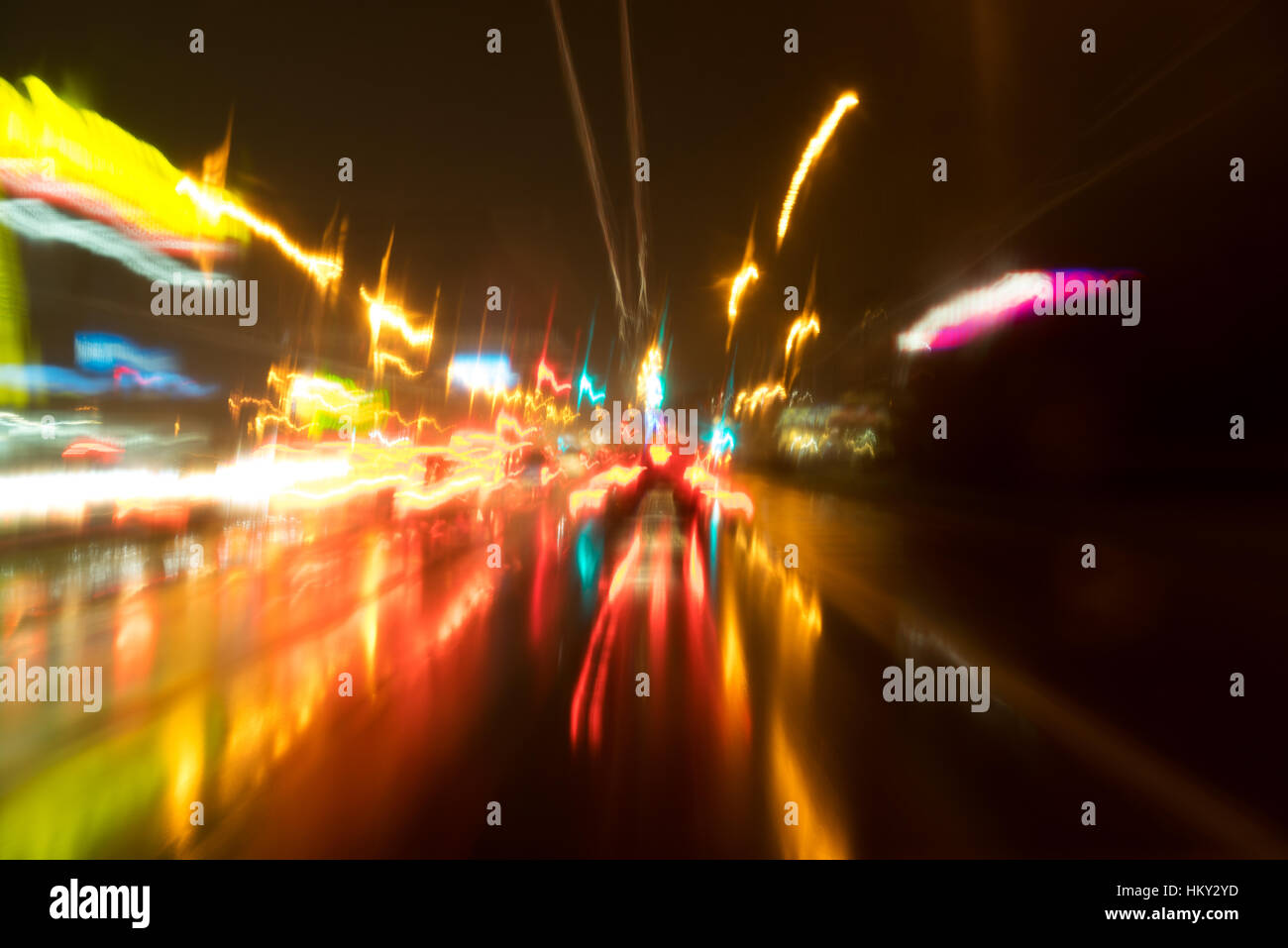 Abstract traffic with color lights in the dark. Blurred car and road ...