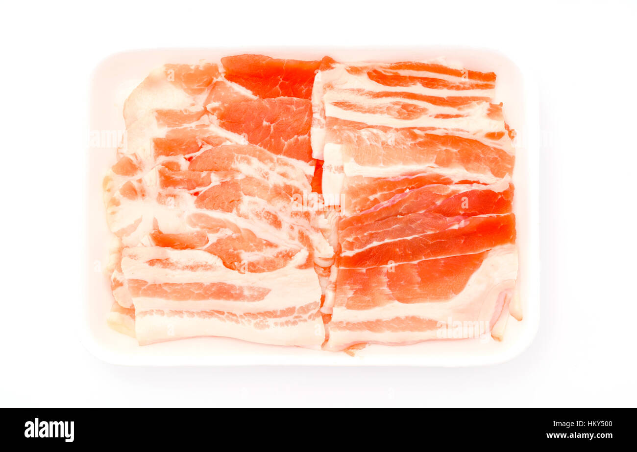 Slide of raw pork on white background Stock Photo - Alamy