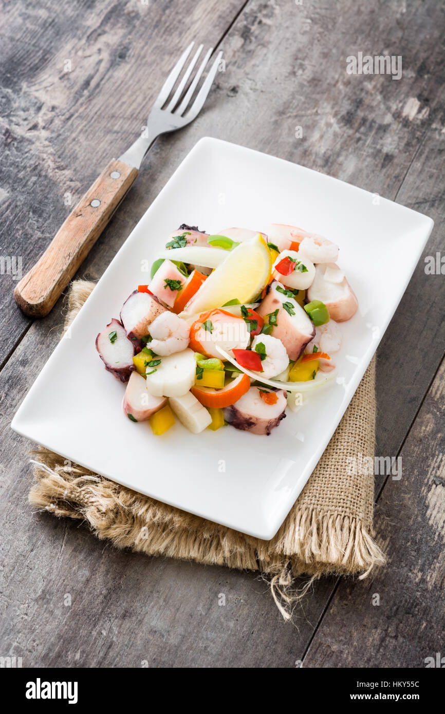 Traditional seafood ceviche from Peru on wooden background Stock Photo ...