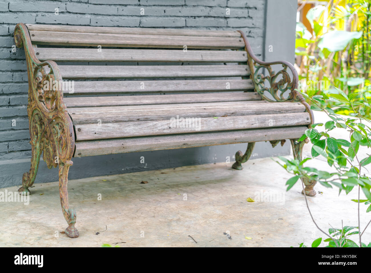Wood Bench against brick wall Stock Photo - Alamy