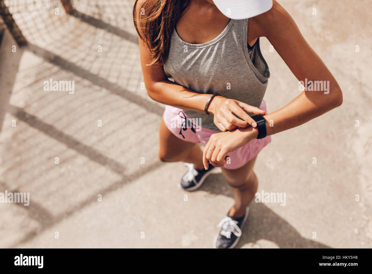 Top view shot of young woman checking fitness progress on her smart ...