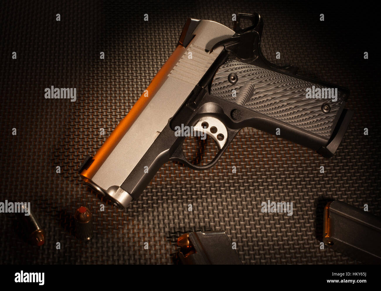 Semi automatic handgun that in on a textured gray background Stock ...